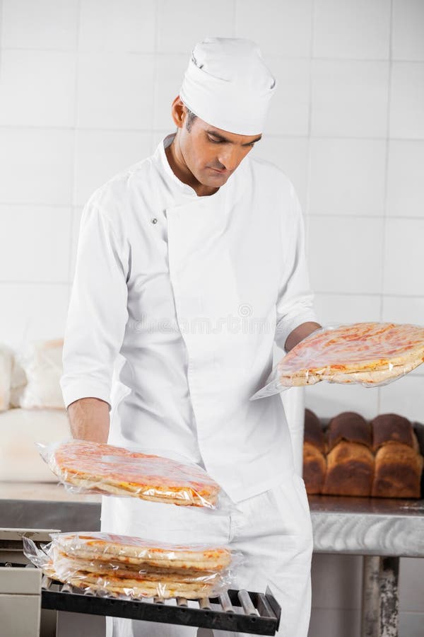 Male Baker Packing Pizza Breads Stock Photo - Image of commercial, food ...