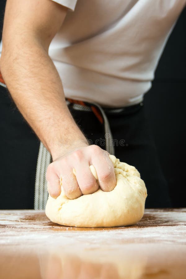 Male Baker Punching Dough from the Table Stock Image - Image of ...