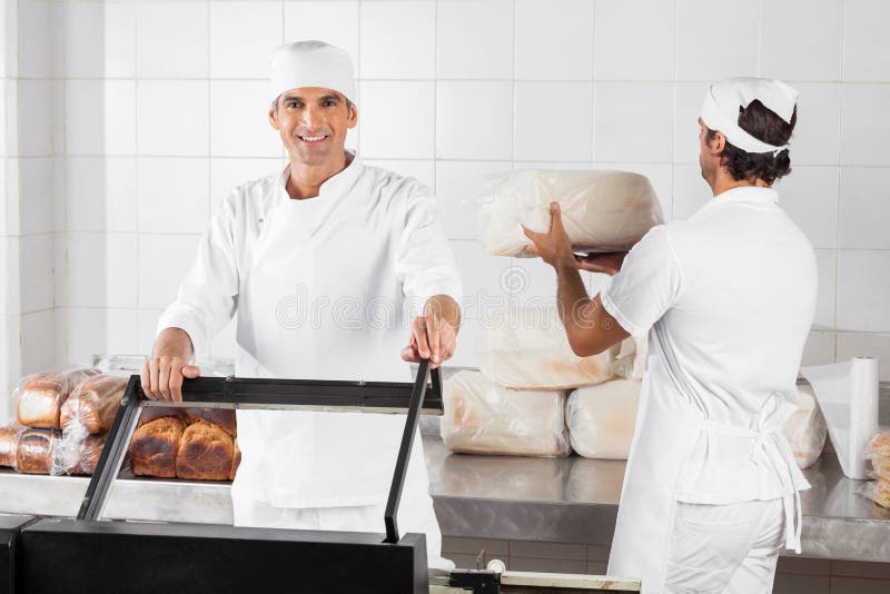 Male Baker Using Vacuum Seal Machine in Bakery Stock Image - Image of ...