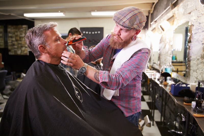 Male Barber Giving Client Shave in Shop Stock Photo - Image of four ...
