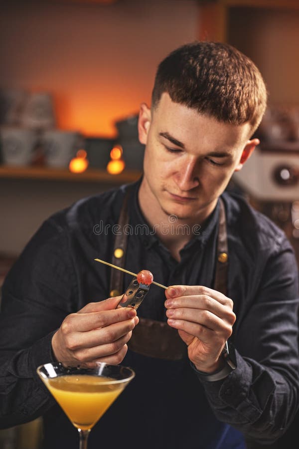 Male Bartender Decorates Cocktail Stock Image - Image of toothpick ...