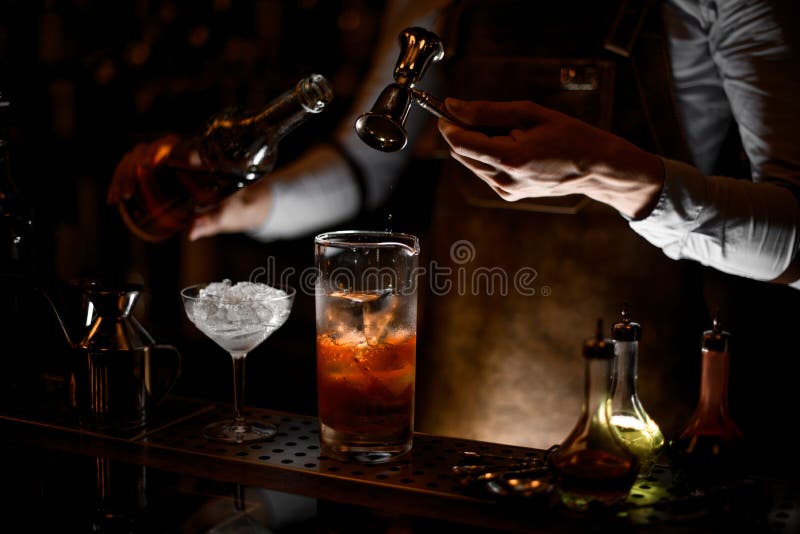 Bartender Pours Alcohol Cocktail Using Jigger with Handle Stock Photo ...