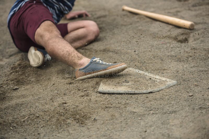 Baseball Player Reaching Base during Game on Court Stock Photo - Image ...