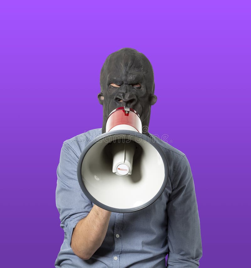 Male in a Black Angry Mask Talking on a Megaphone Stock Photo - Image ...