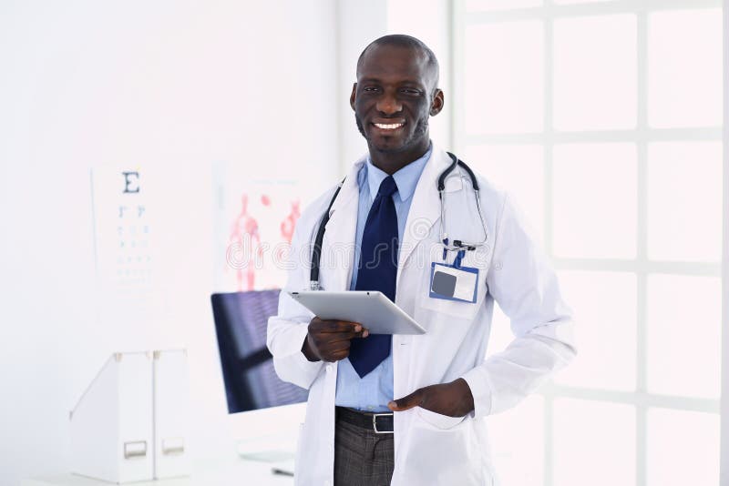 Male Black Doctor Worker with Tablet Computer Standing in Hospital ...