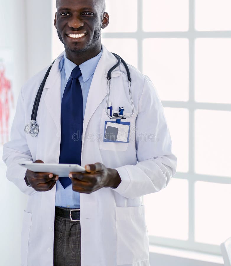 Male Black Doctor Worker with Tablet Computer Standing in Hospital ...