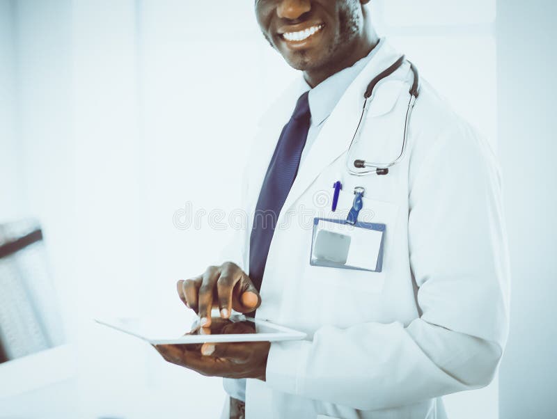 Male Black Doctor Worker with Tablet Computer Standing in Hospital ...