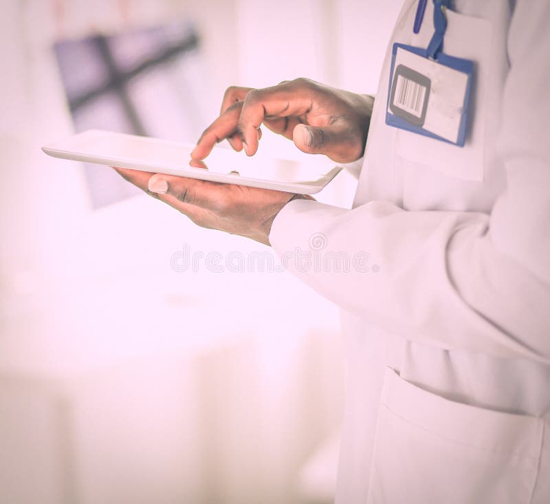 Male Black Doctor Worker with Tablet Computer Standing in Hospital ...