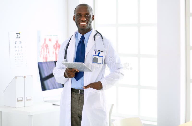 Male Black Doctor Worker with Tablet Computer Standing in Hospital ...