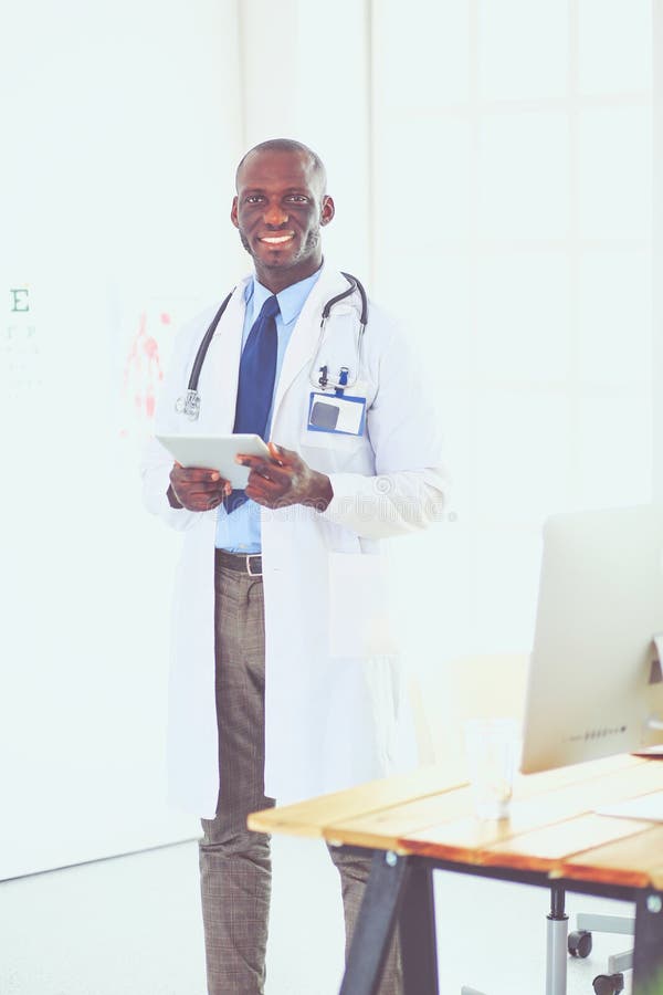 Male Black Doctor Worker with Tablet Computer Standing in Hospital ...