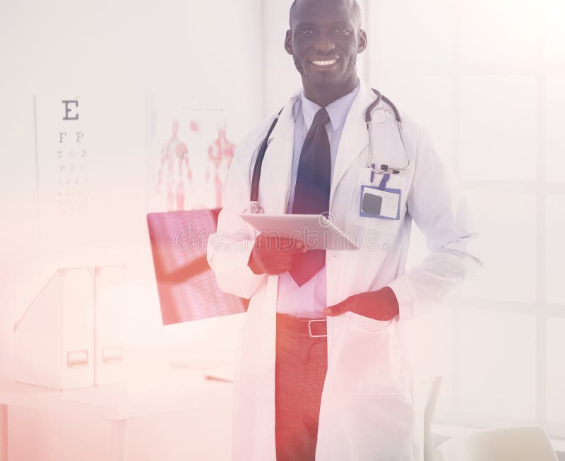 Male Black Doctor Worker with Tablet Computer Standing in Hospital ...