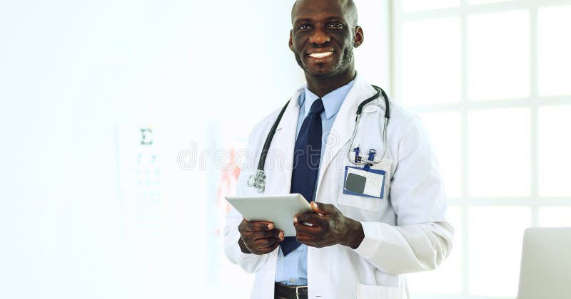 Male Black Doctor Worker with Tablet Computer Standing in Hospital ...