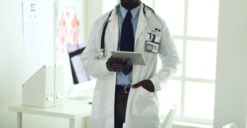 Male Black Doctor Worker with Tablet Computer Standing in Hospital ...