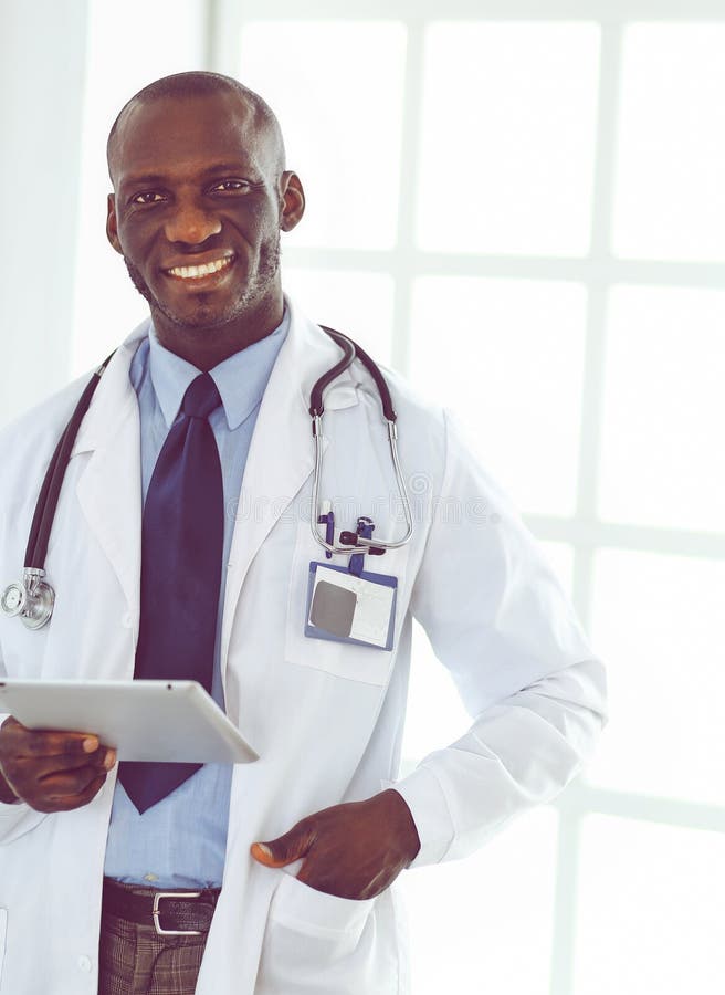 Male Black Doctor Worker with Tablet Computer Standing in Hospital ...
