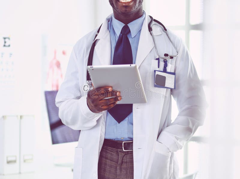 Male Black Doctor Worker with Tablet Computer Standing in Hospital ...