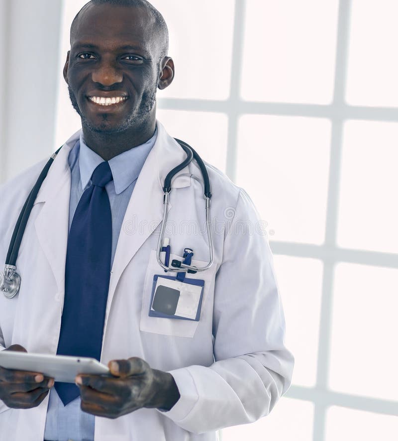 Male Black Doctor Worker with Tablet Computer Standing in Hospital ...