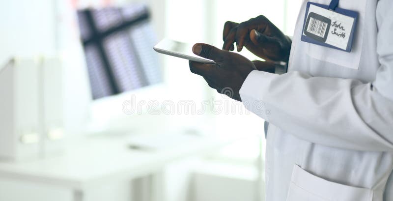 Male Black Doctor Worker with Tablet Computer Standing in Hospital ...