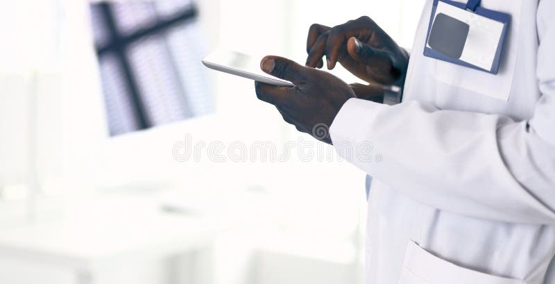 Male Black Doctor Worker with Tablet Computer Standing in Hospital ...