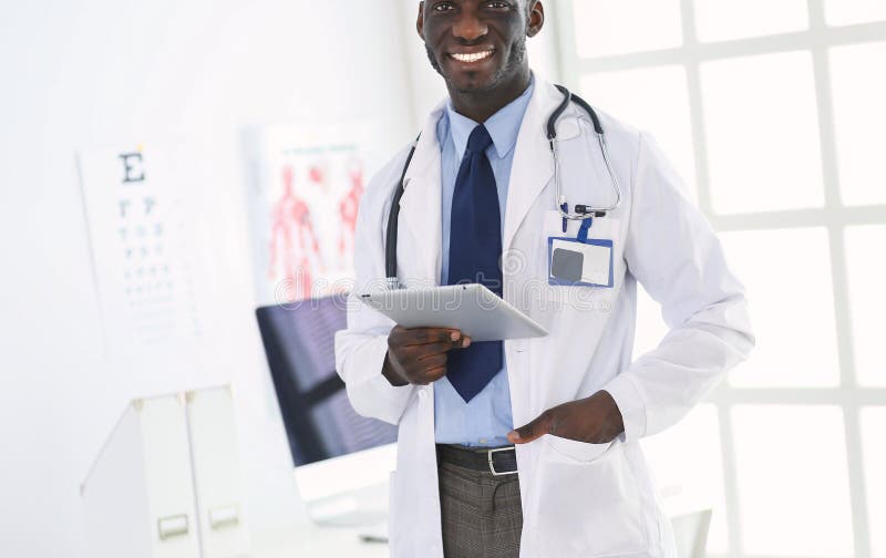 Male Black Doctor Worker with Tablet Computer Standing in Hospital ...