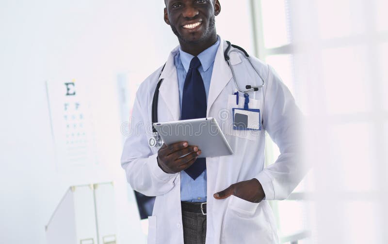 Male Black Doctor Worker with Tablet Computer Standing in Hospital ...