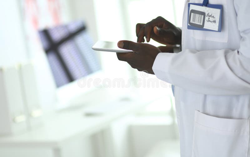 Male Black Doctor Worker with Tablet Computer Standing in Hospital ...