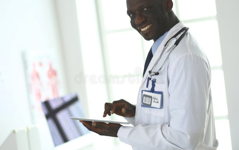 Male Black Doctor Worker with Tablet Computer Standing in Hospital ...