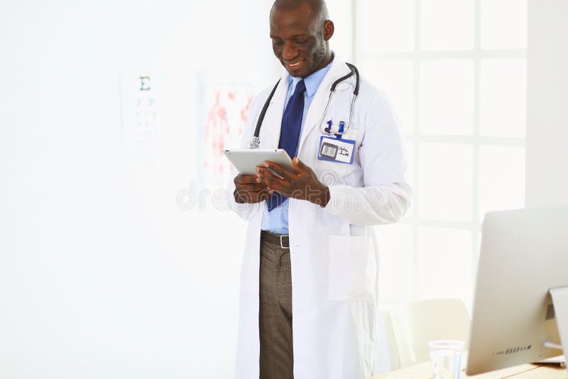 Male Black Doctor Worker with Tablet Computer Standing in Hospital ...