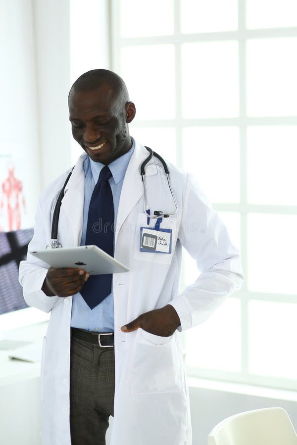Male Black Doctor Worker with Tablet Computer Standing in Hospital ...