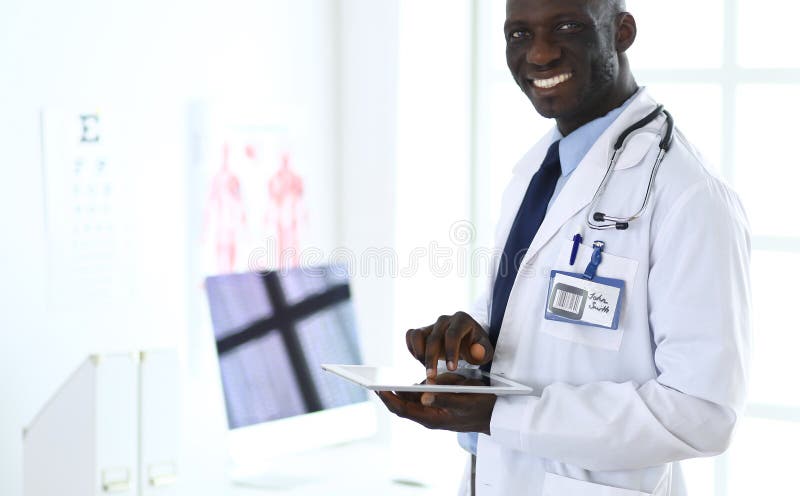 Male Black Doctor Worker with Tablet Computer Standing in Hospital ...