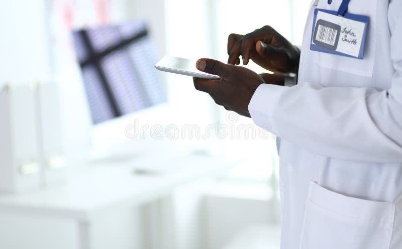 Male Black Doctor Worker with Tablet Computer Standing in Hospital ...