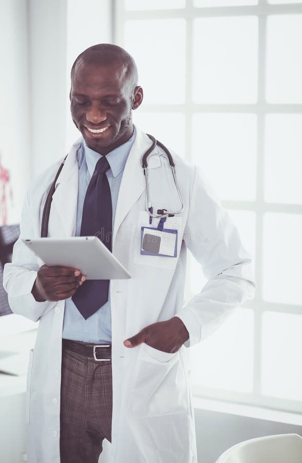 Male Black Doctor Worker with Tablet Computer Standing in Hospital ...