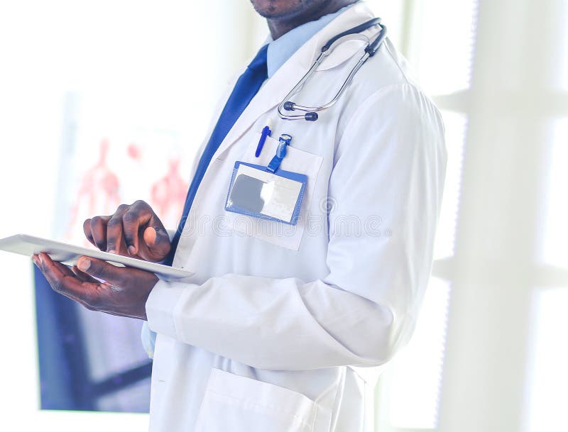Male Black Doctor Worker with Tablet Computer Standing in Hospital ...