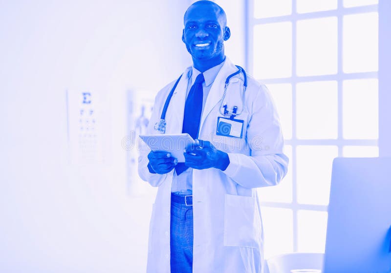 Male Black Doctor Worker with Tablet Computer Standing in Hospital ...
