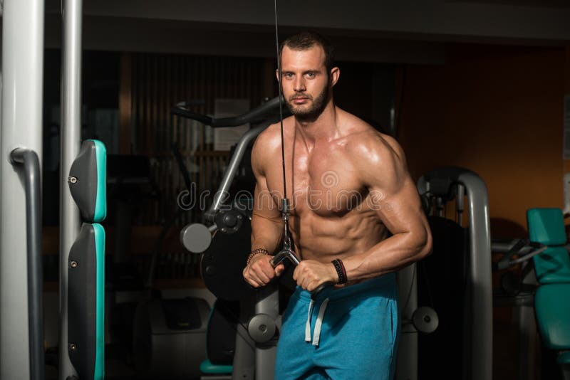 Male Bodybuilder Doing Heavy Weight Exercise for Triceps Stock Photo ...