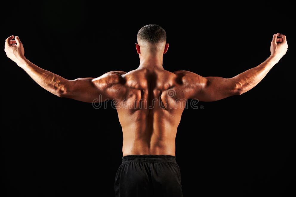 Male Bodybuilder Flexing Muscles, Back View Stock Image - Image of ...