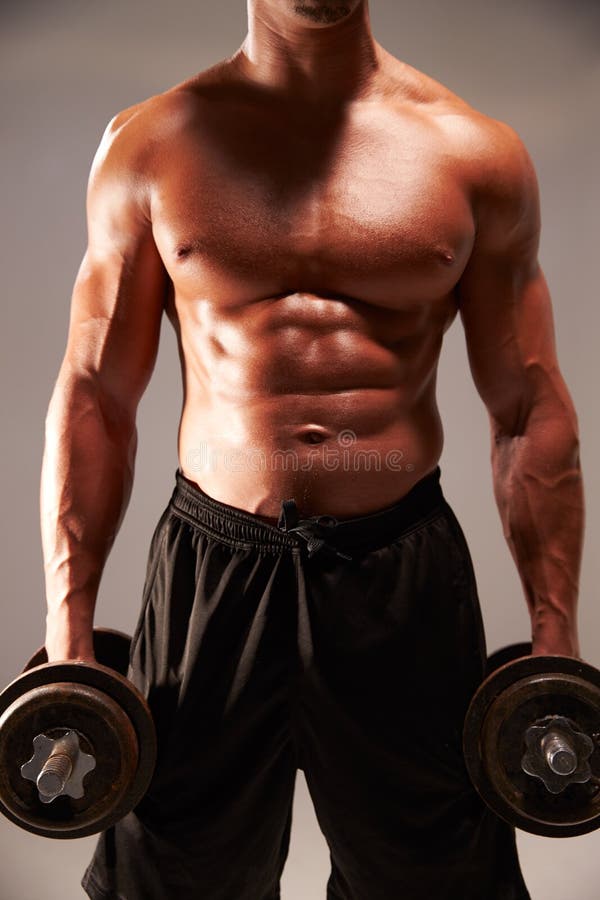 Male Bodybuilder Holding Heavy Dumbbells Stock Image - Image of muscle ...
