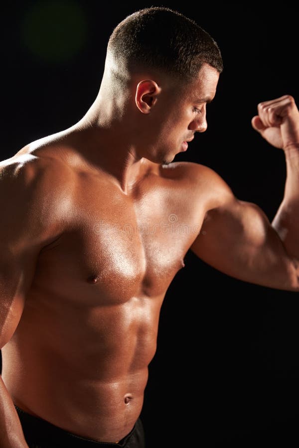 Male Bodybuilder Flexing His Biceps, Back View Stock Photo - Image of ...