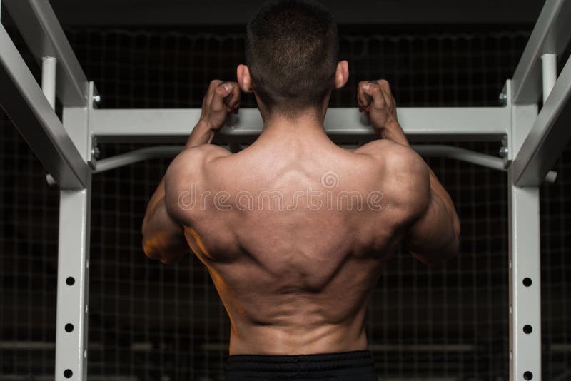 Male Bodybuilding Athlete Doing Pull Ups Stock Photo - Image of beard ...