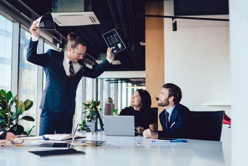Male Boss Solving Problems with Report Statistics during Briefing ...