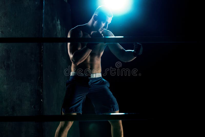 Male Boxer Boxing in a Dark Studio Stock Photo - Image of athlete ...