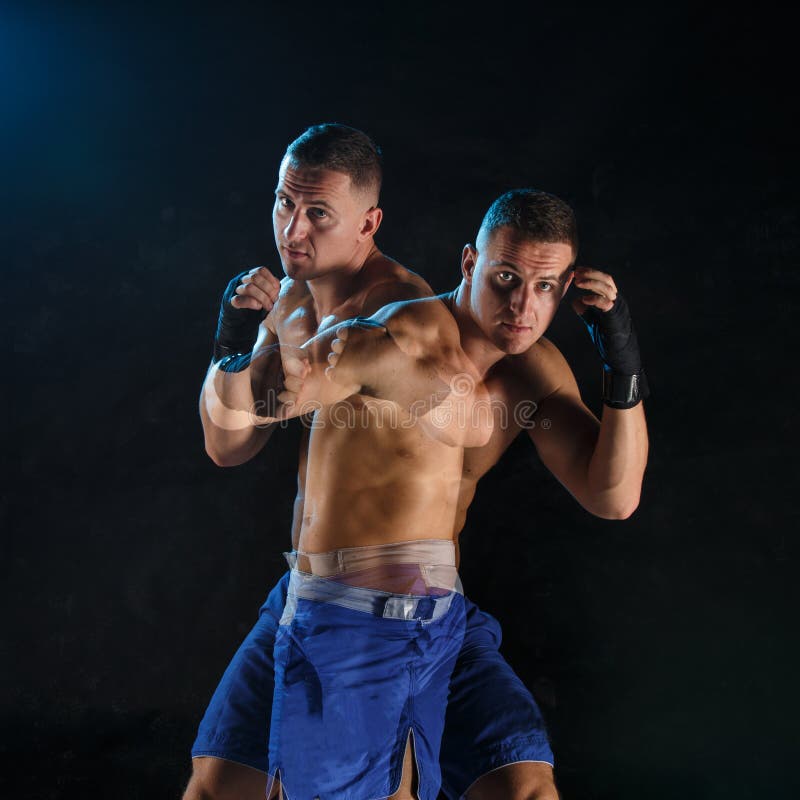 Male Boxer Boxing in a Dark Studio Stock Photo - Image of adult ...