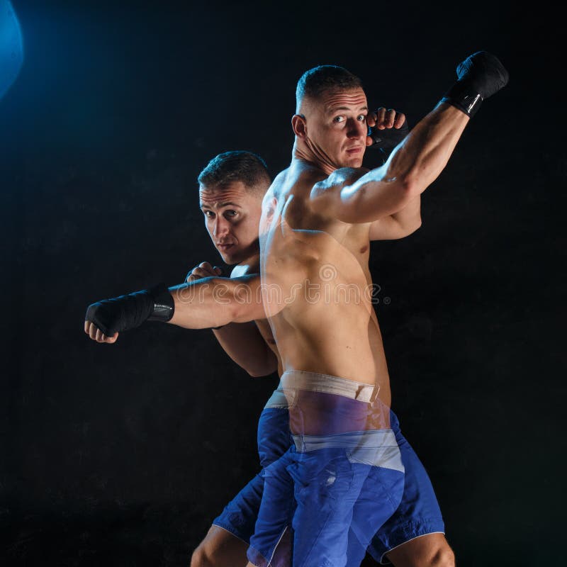 Male Boxer Boxing in a Dark Studio Stock Image - Image of muscle, body ...