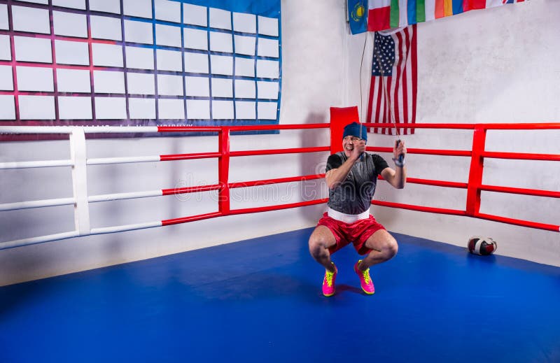 Male Boxer Standing in a Pose Clenching His Fists in a Regular B Stock ...