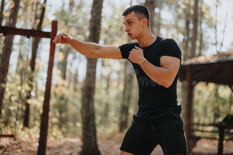 Handsome Male Person Training Box in a Park at the Forest. Stock Photo ...