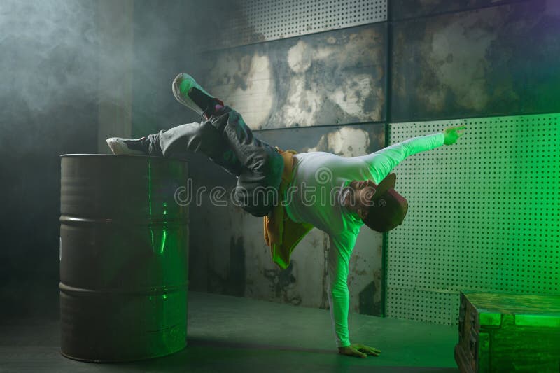 Male Break Dancer Performing on Loft Stage in Green Neon Light Stock ...
