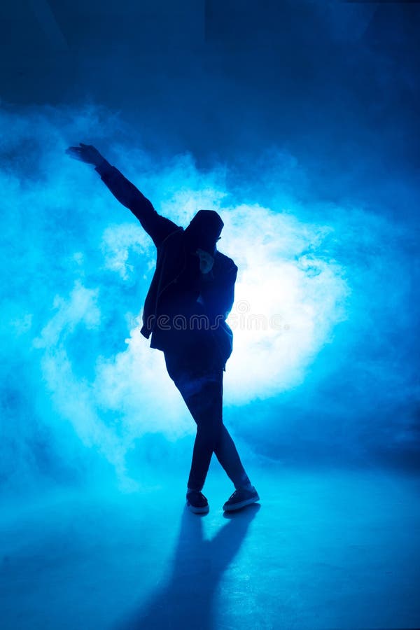 Male Break Dancer Performs on Blue Neon Stage His Expressive Dance ...