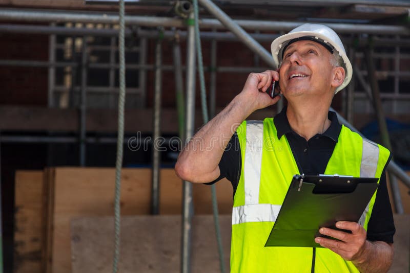 Male Builder Construction Worker on Building Site with Clipboard and ...