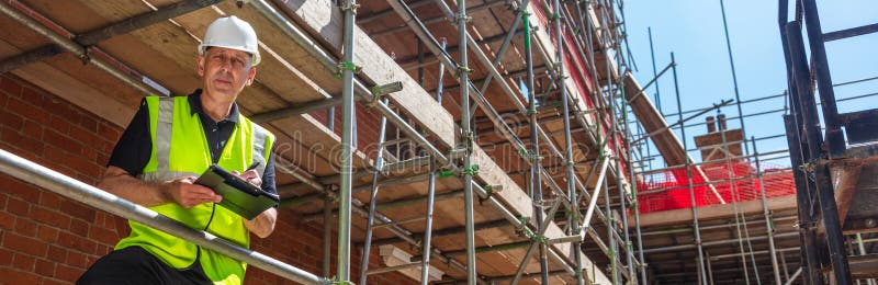 Rear View of a Builder, Architect or Construction Worker on Building ...