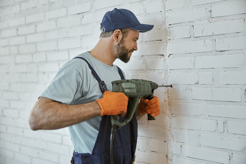 Male Builder Drilling Wall with Hammer Drill Stock Image - Image of ...