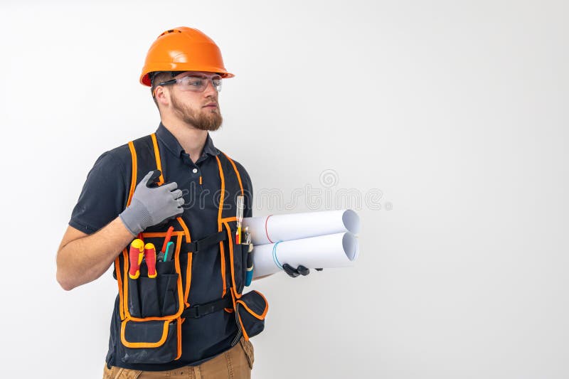 Male Builder. Electrical Engineer in Overalls and Helmet Holds ...
